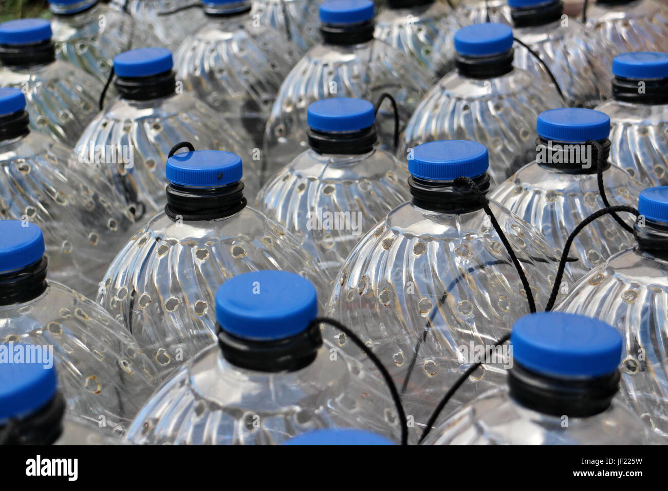 Row of blue bottles hi-res stock photography and images - Alamy
