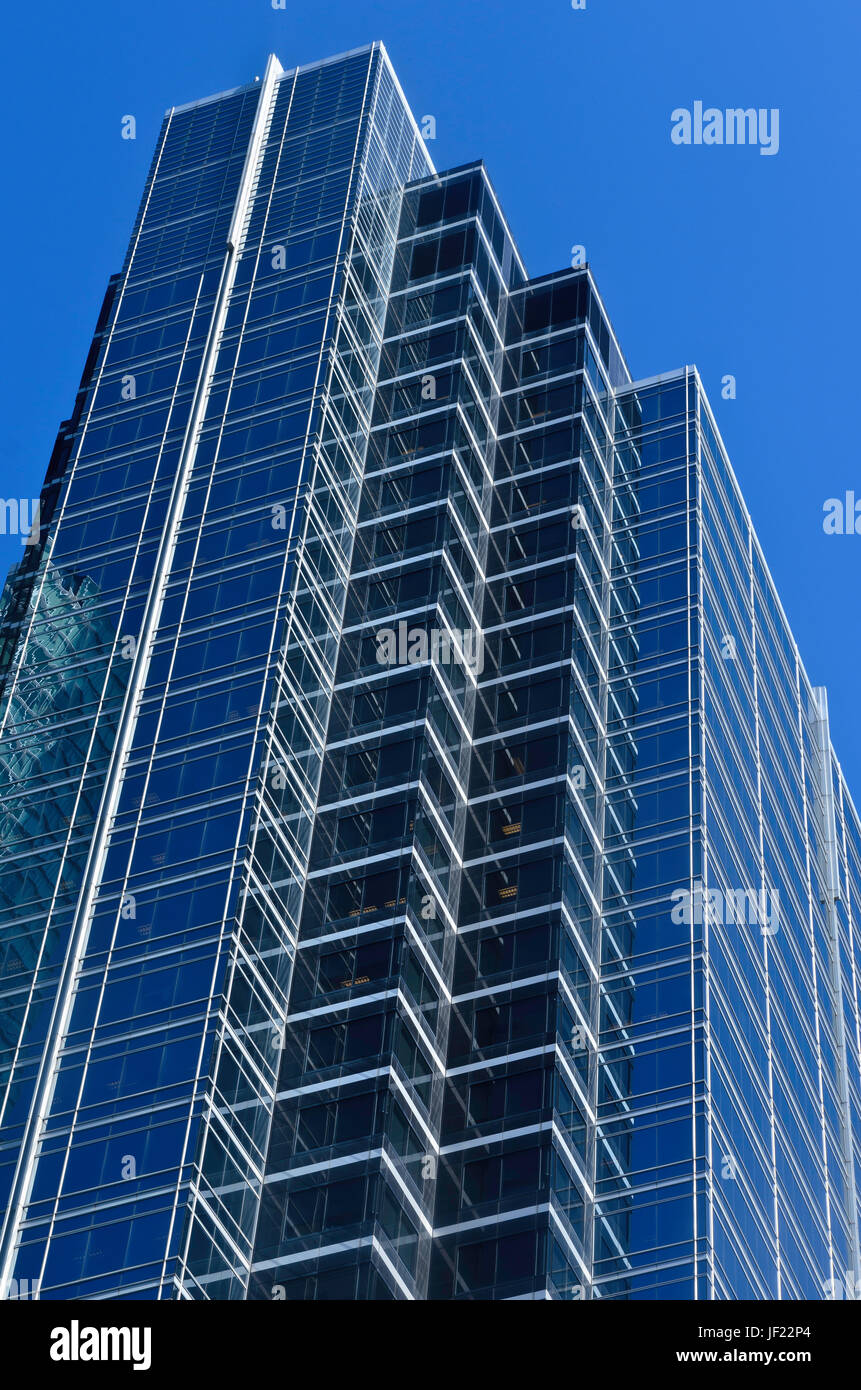 Looking up at a modern blue colored steel and glass office tower Stock ...