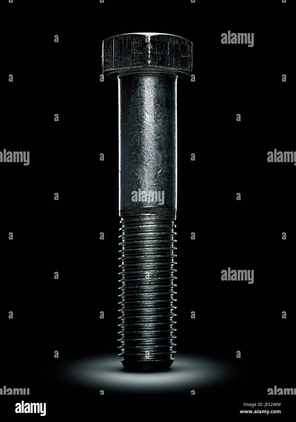 Screw on black background Stock Photo - Alamy
