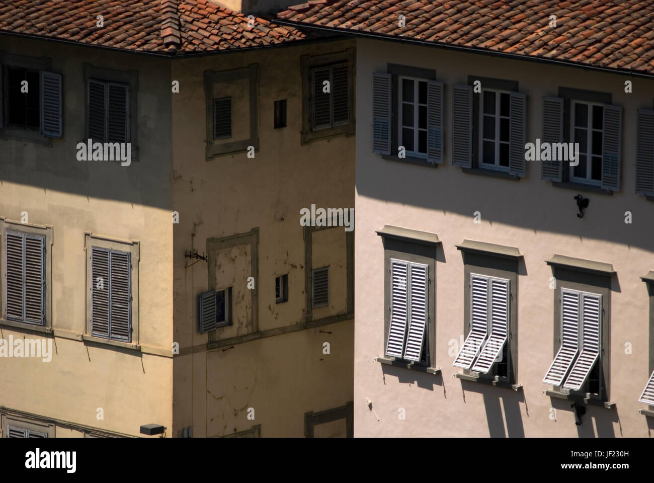 Traditional Florence houses with wooden shutters and tile roofs Stock ...