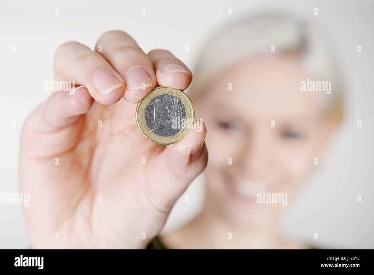woman presenting one Euro Stock Photo - Alamy