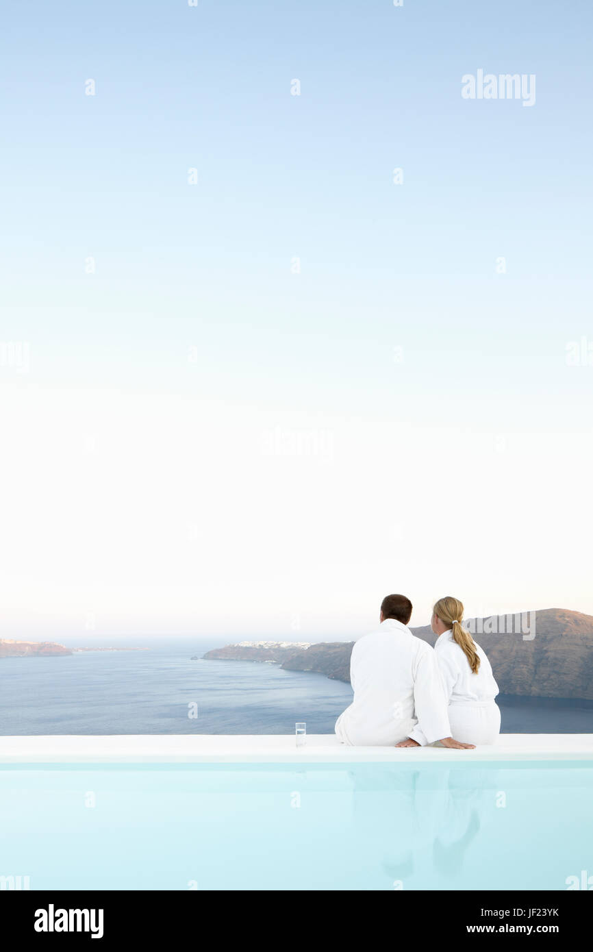 Couple hugging at swimming-pool Stock Photo - Alamy