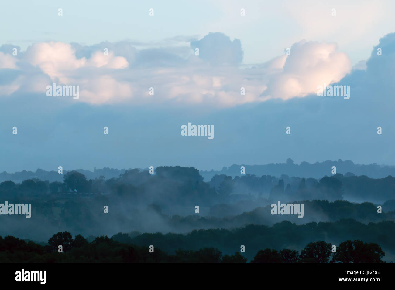 Mist Across Valley Stock Photo - Alamy