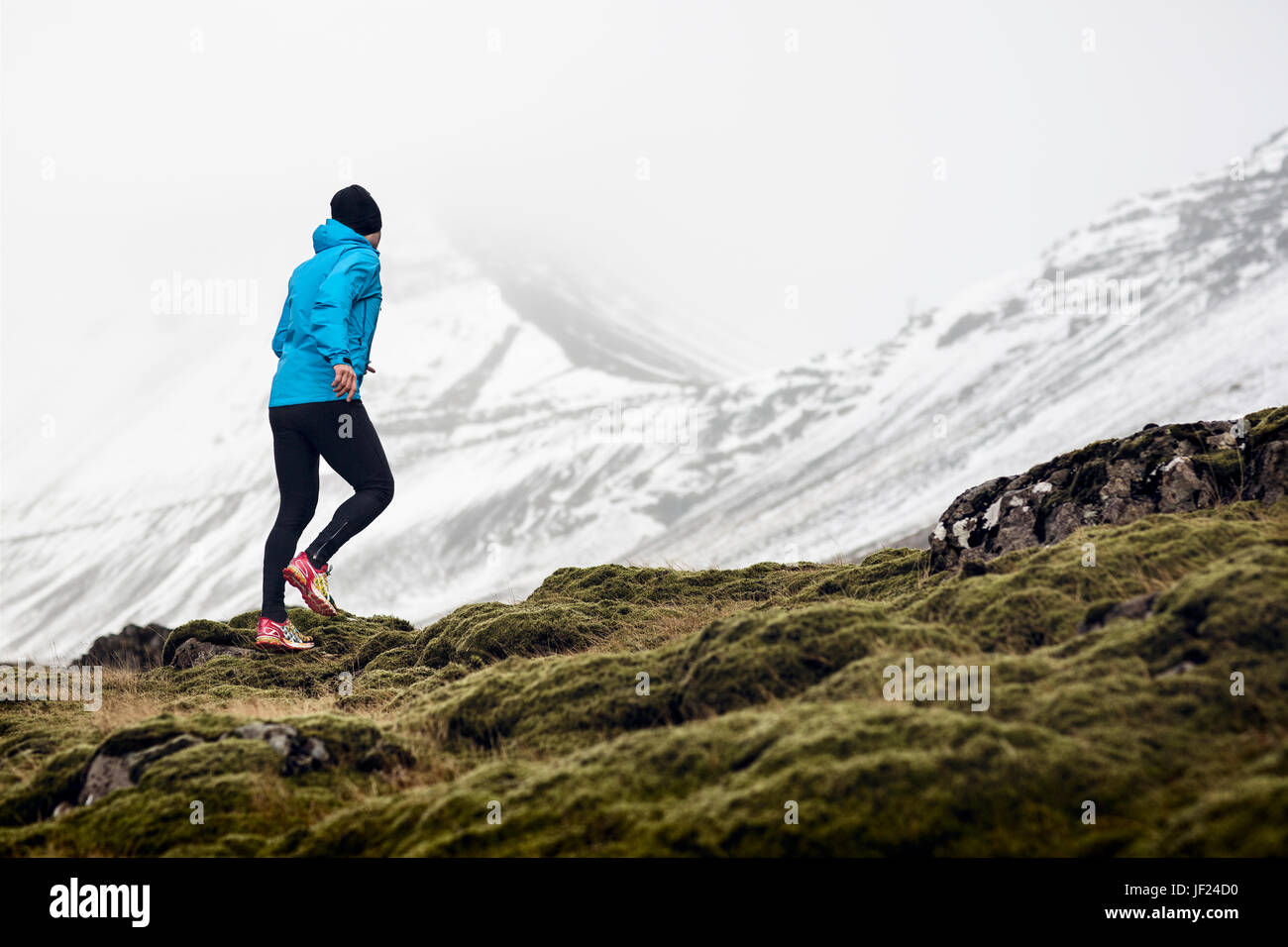 Man jogging in mountains Stock Photo - Alamy