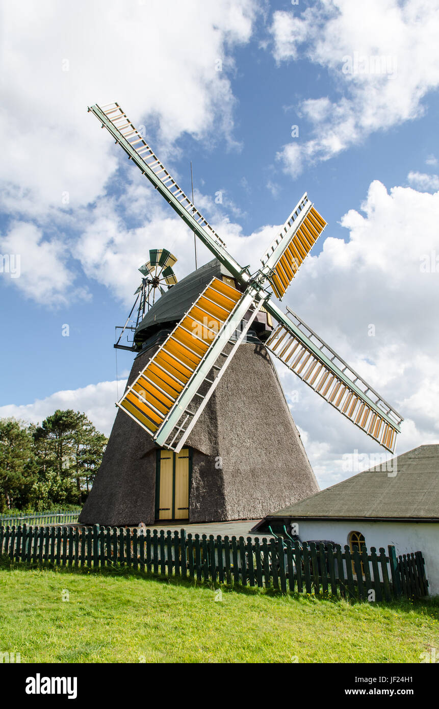 windmill with cottage and fence Stock Photo - Alamy