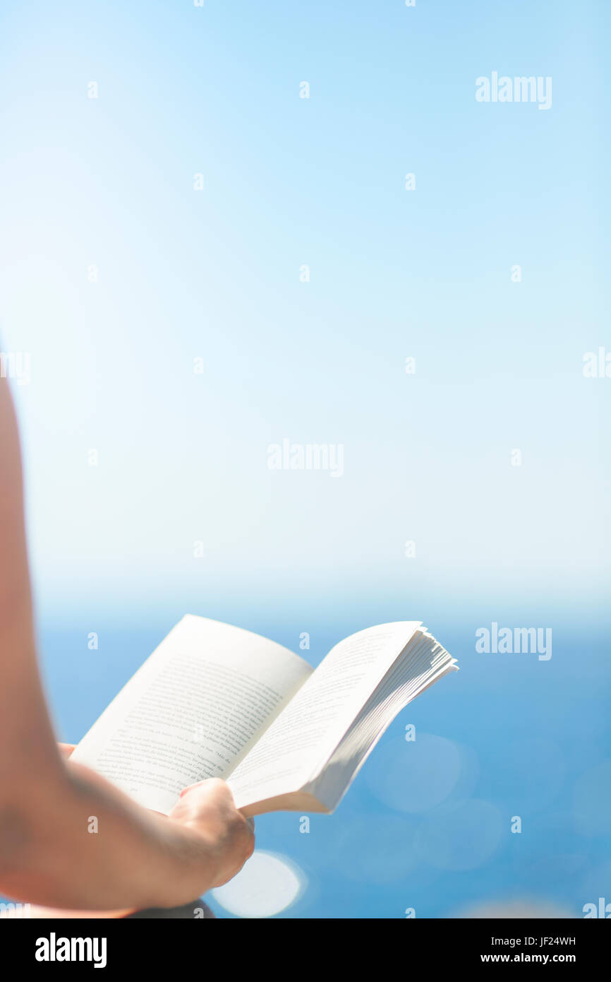 Hands holding book hi-res stock photography and images - Alamy