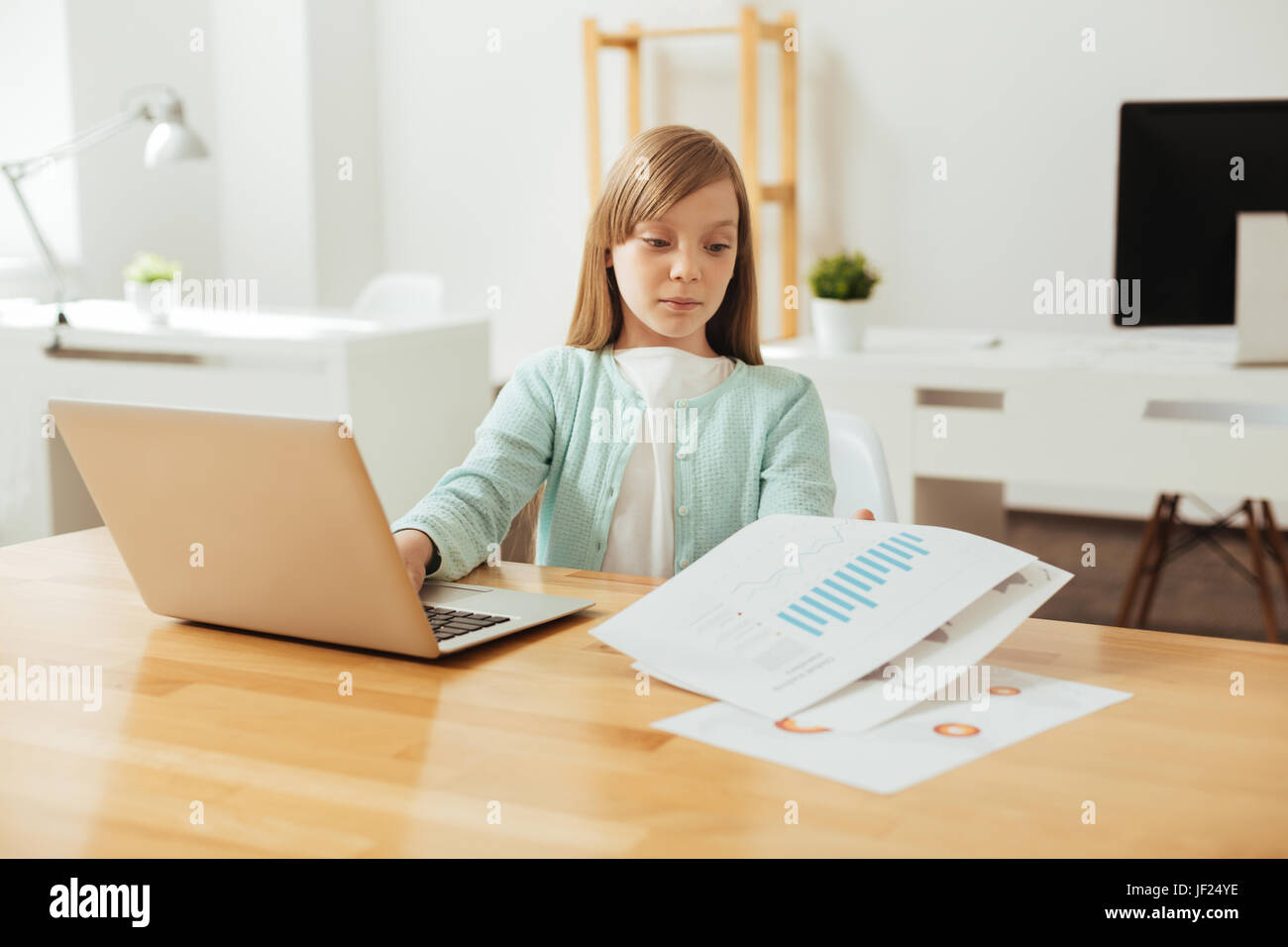 Talented gorgeous girl working on her school project Stock Photo - Alamy