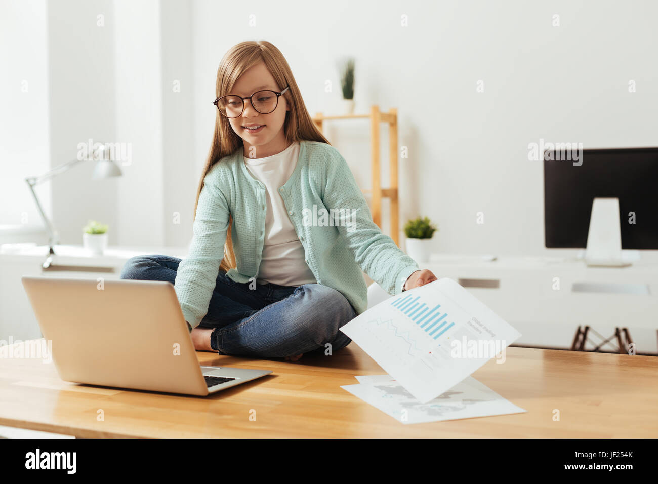 Smart lively girl being a dedicated student Stock Photo - Alamy