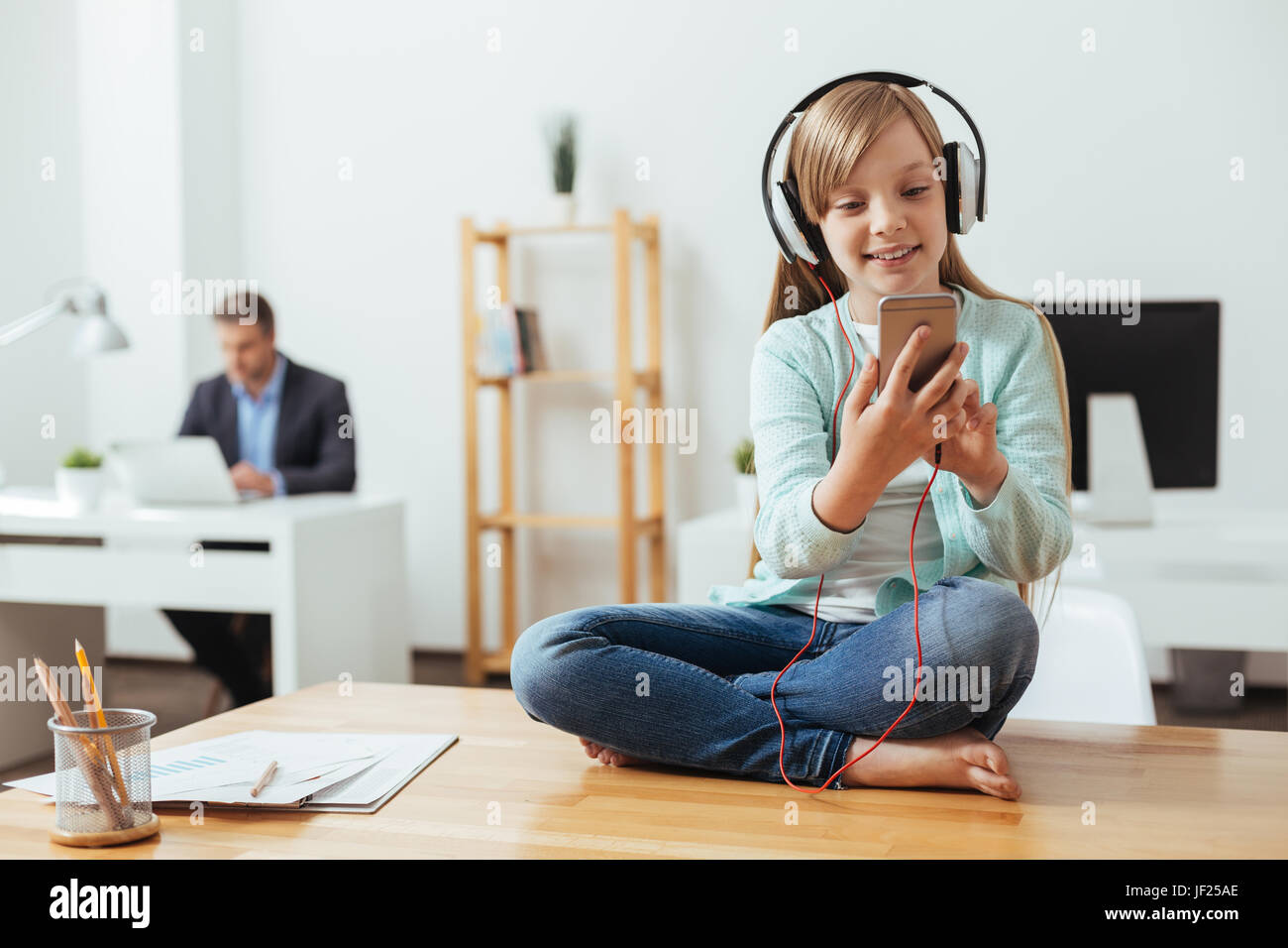 Enthusiastic creative child enjoying her playlist Stock Photo - Alamy