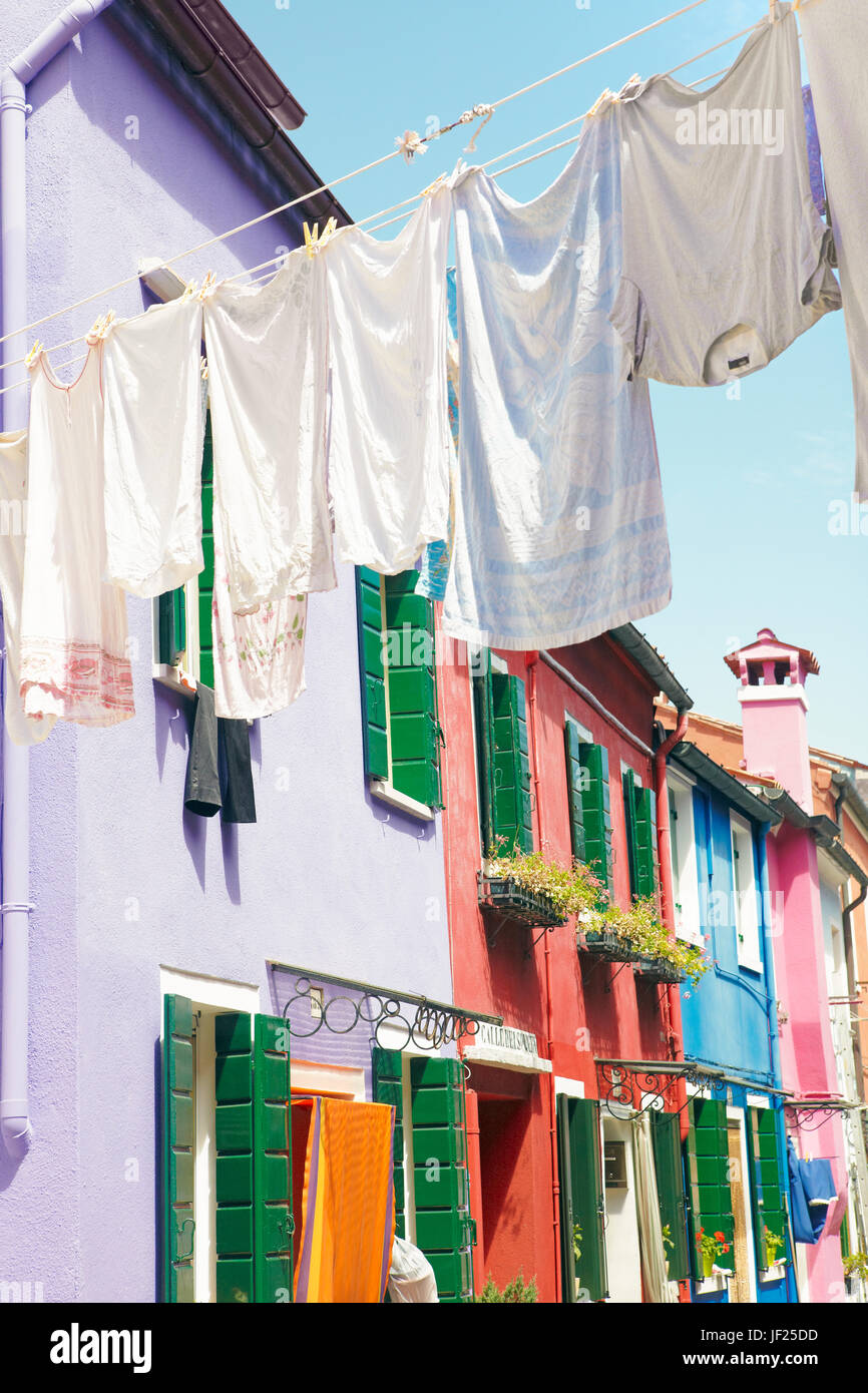 Laundry drying above street Stock Photo - Alamy