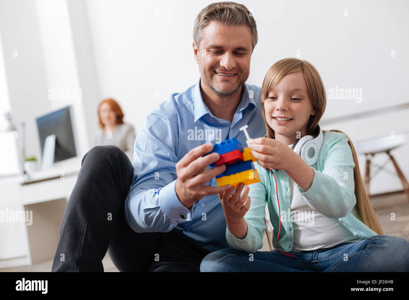 Creative child and her dad building something together Stock Photo - Alamy