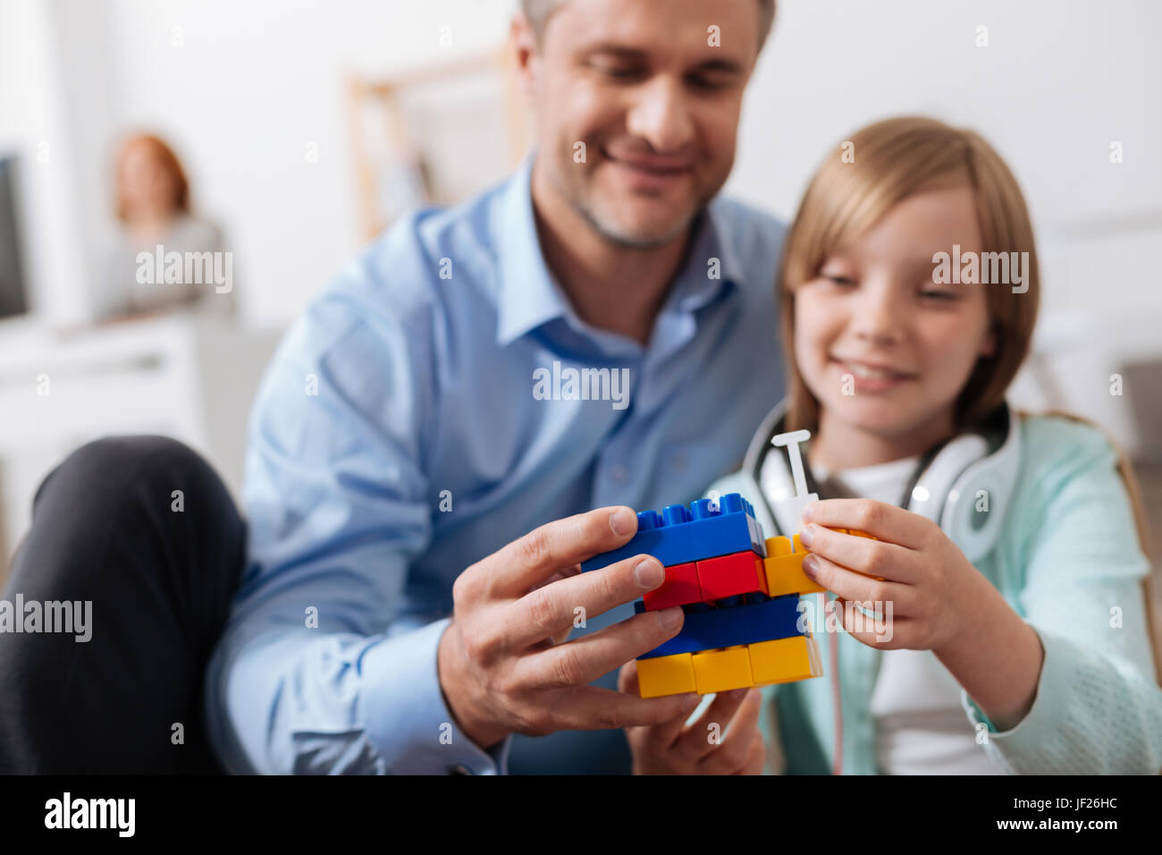Happy loving dad helping his child building something Stock Photo - Alamy