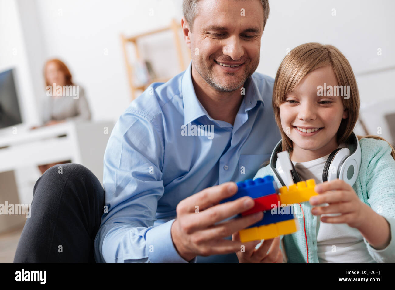 Charismatic happy dad enjoying kids company at work Stock Photo - Alamy