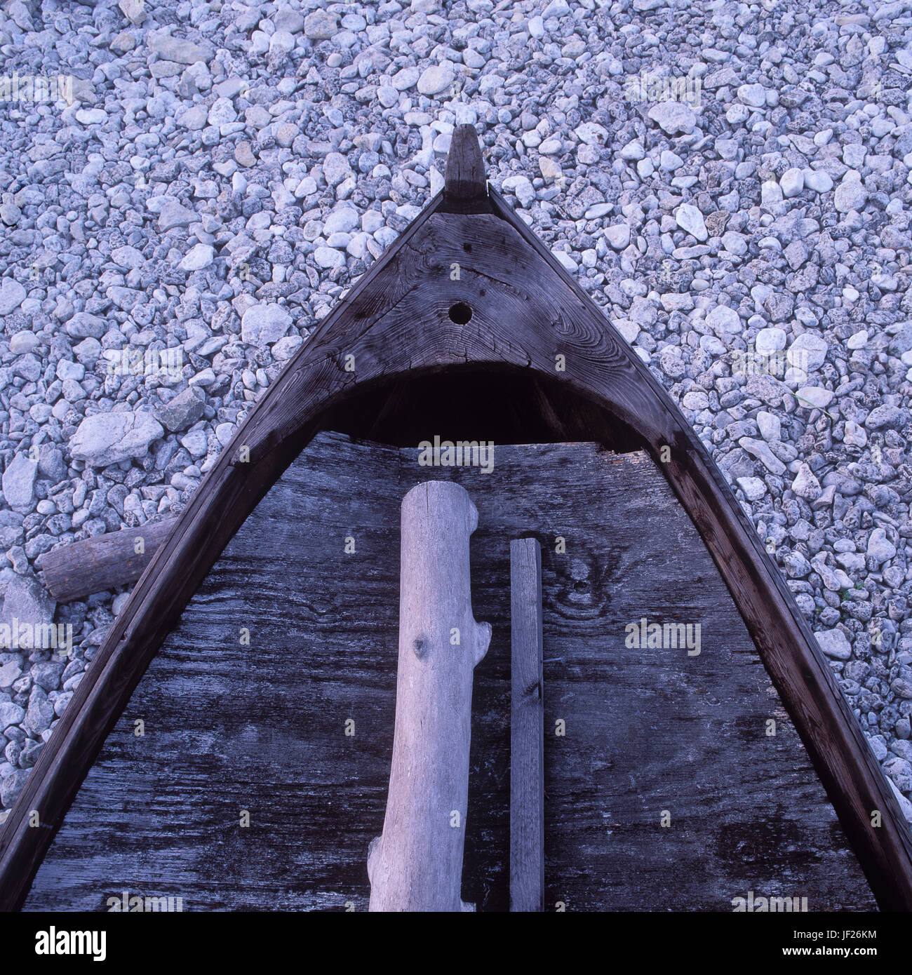 Wooden boat on pebble beach Stock Photo - Alamy