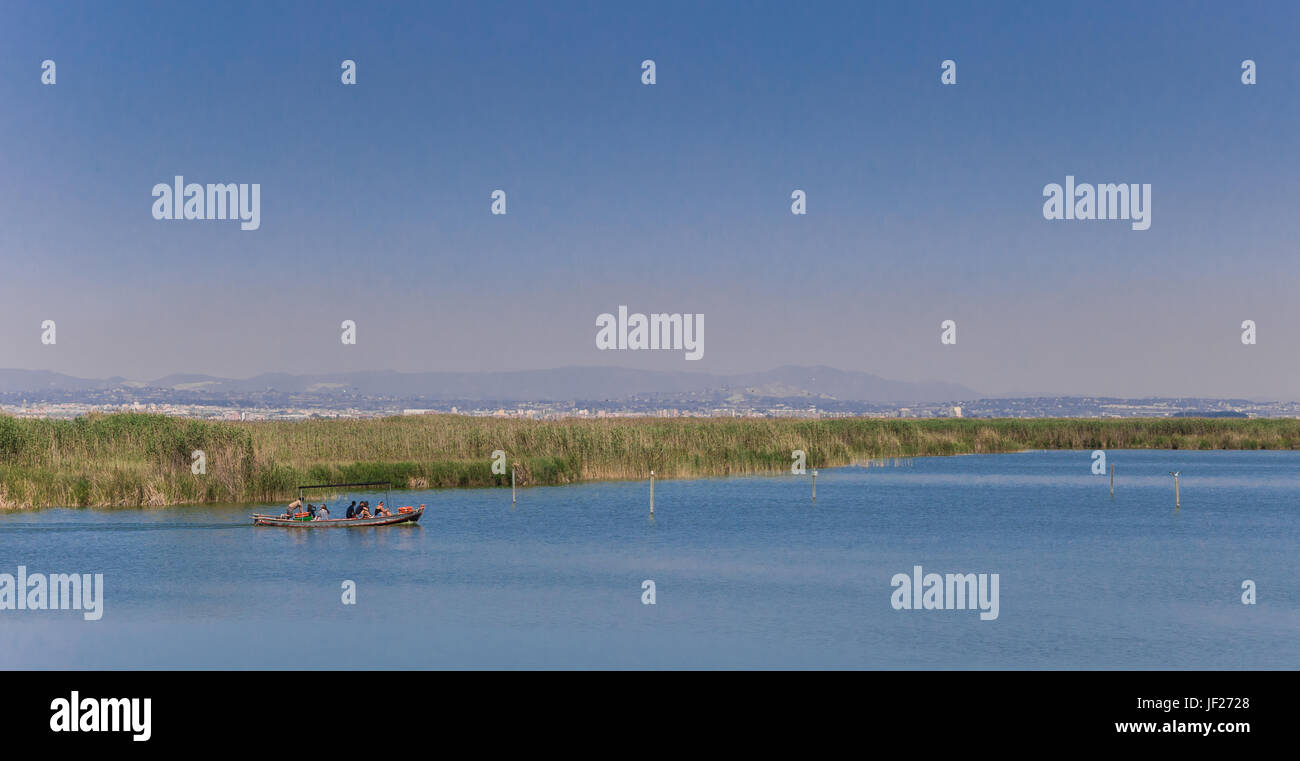 Tourists taking a tour on the lake in La Albufera National Park, near ...