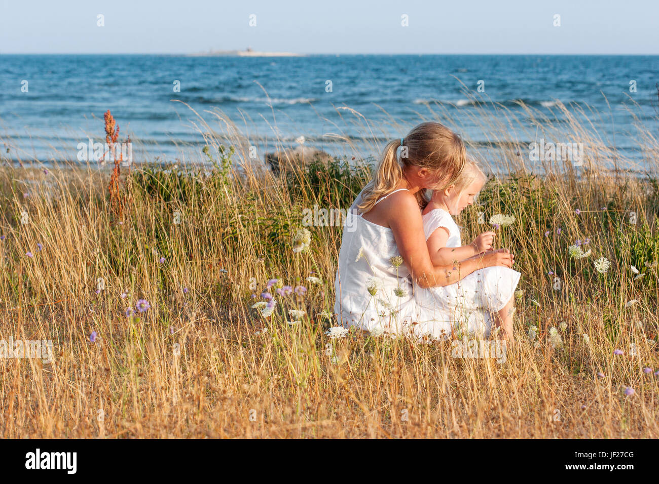 Two girls at sea Stock Photo - Alamy