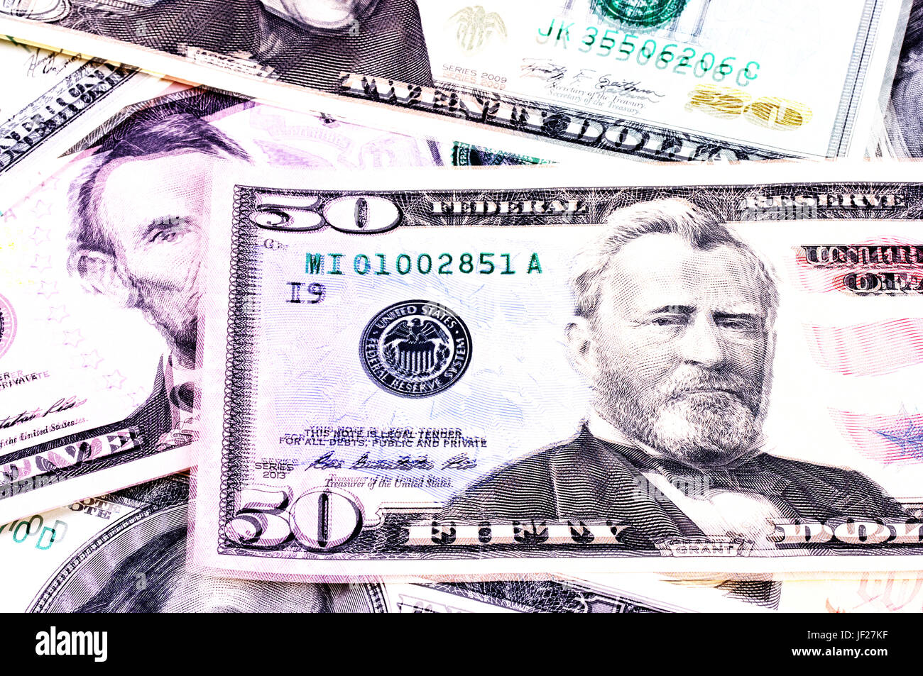 Abstract dollar bills of different denominations background Stock Photo ...