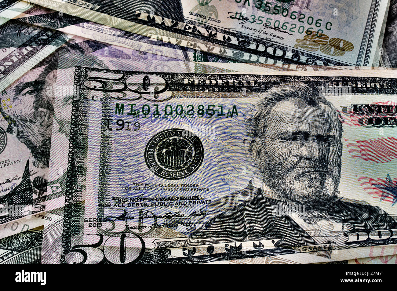 Abstract dollar bills of different denominations background Stock Photo ...