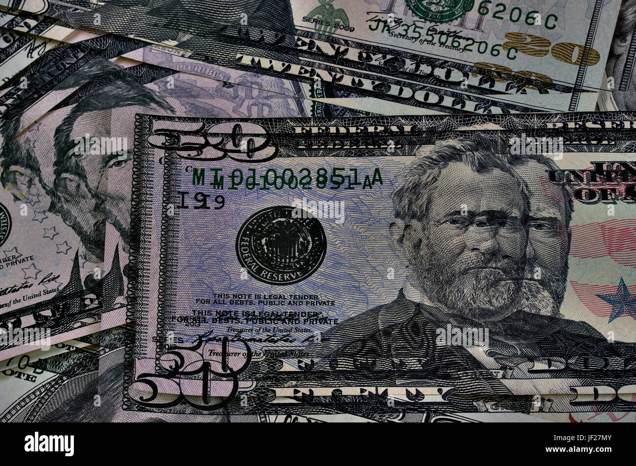 Abstract dollar bills of different denominations background Stock Photo ...