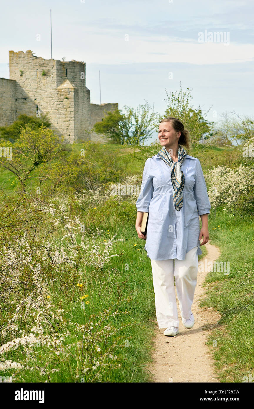 Smiling woman walking Stock Photo - Alamy