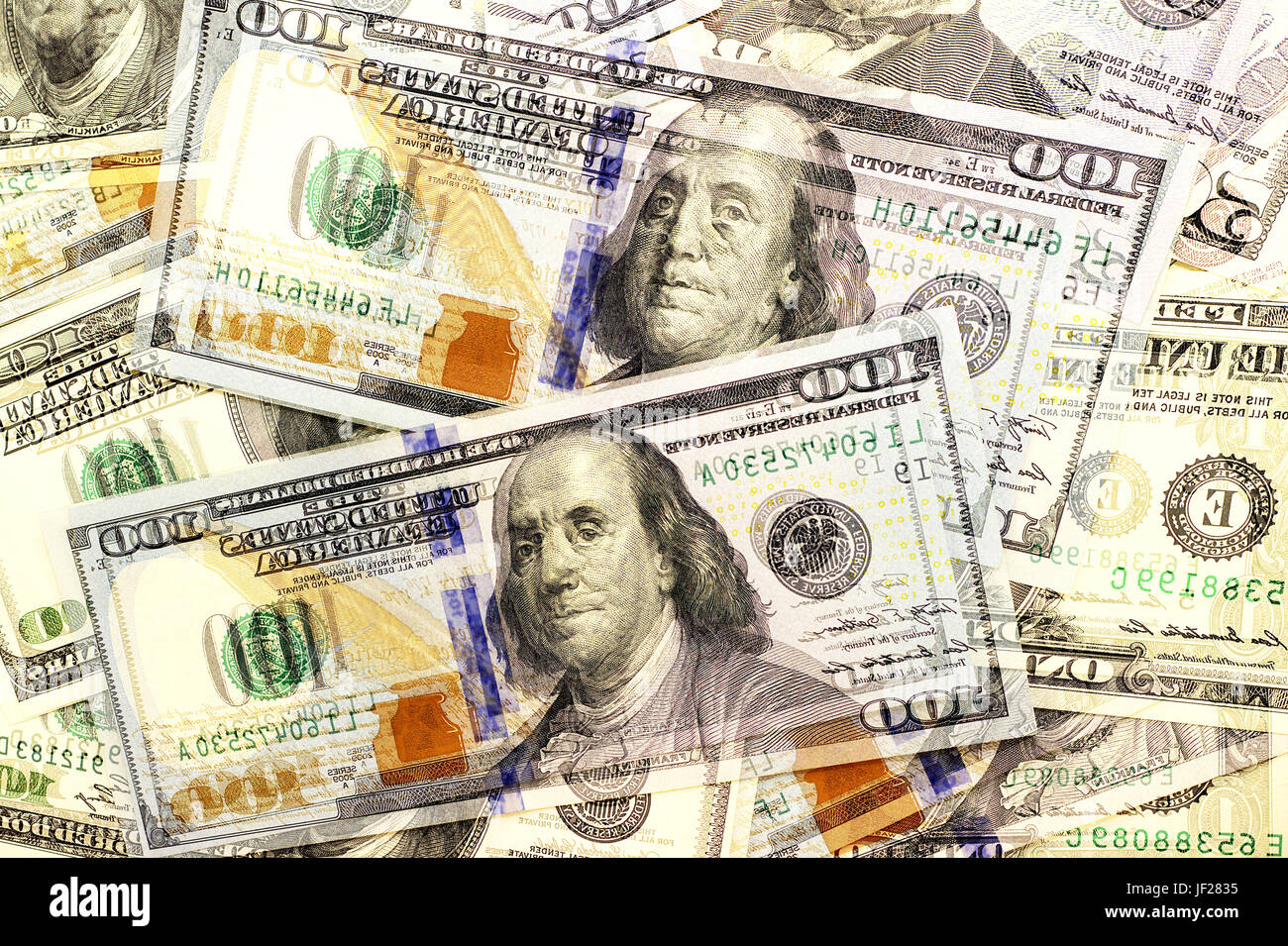 Abstract dollar bills of different denominations background Stock Photo ...