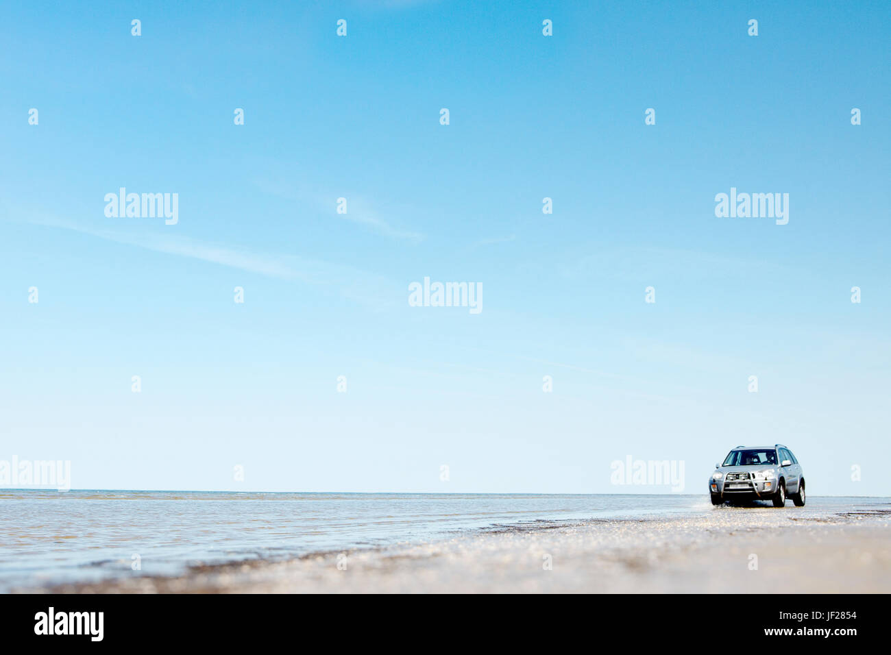 Car on beach Stock Photo - Alamy