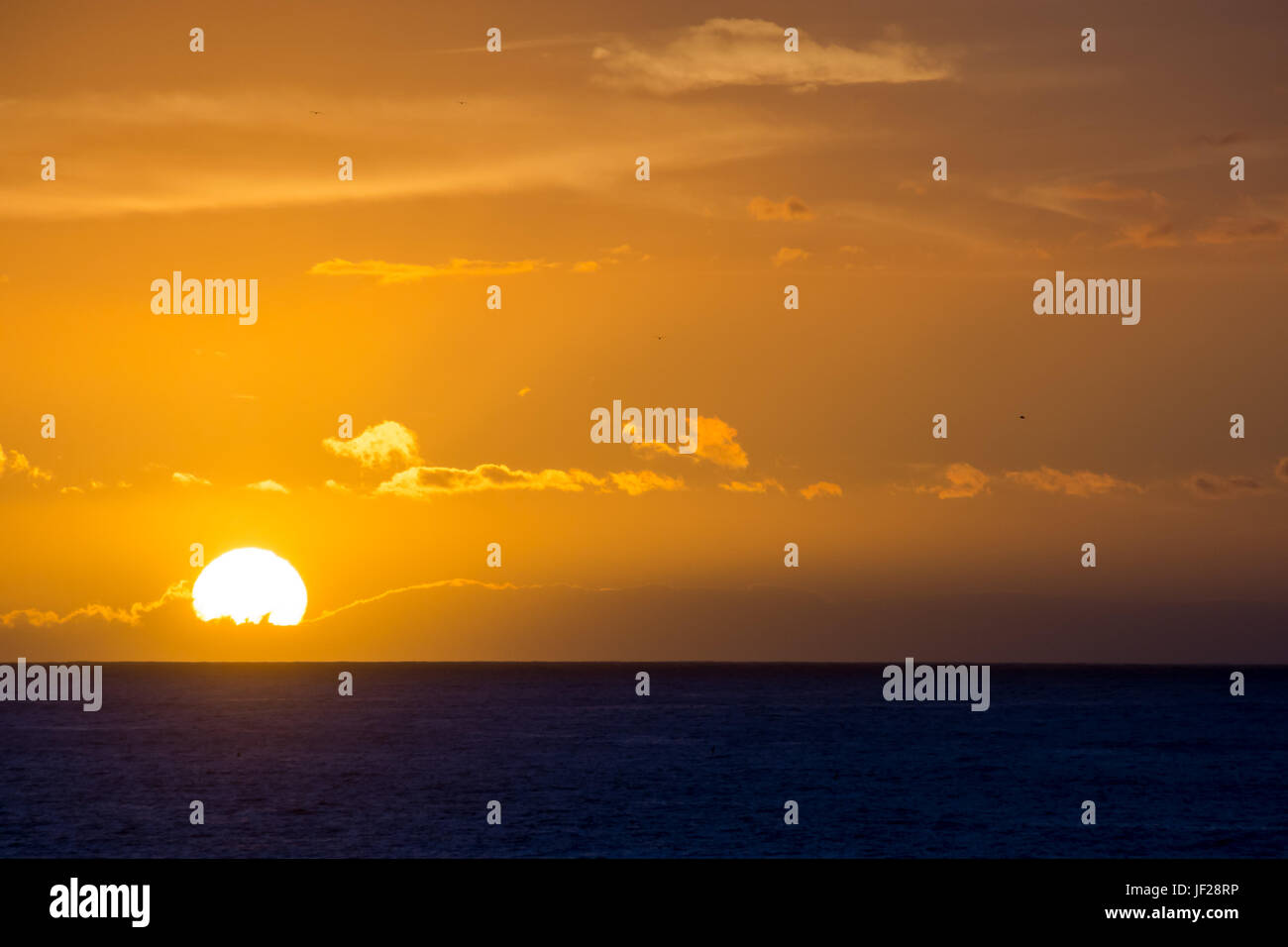 Sun Setting on the Ocean Stock Photo - Alamy