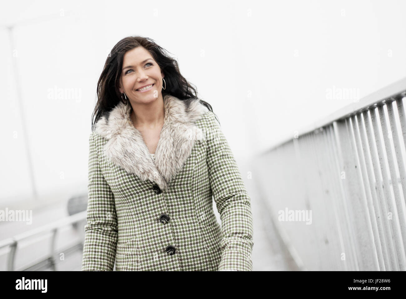 Smiling woman walking Stock Photo - Alamy