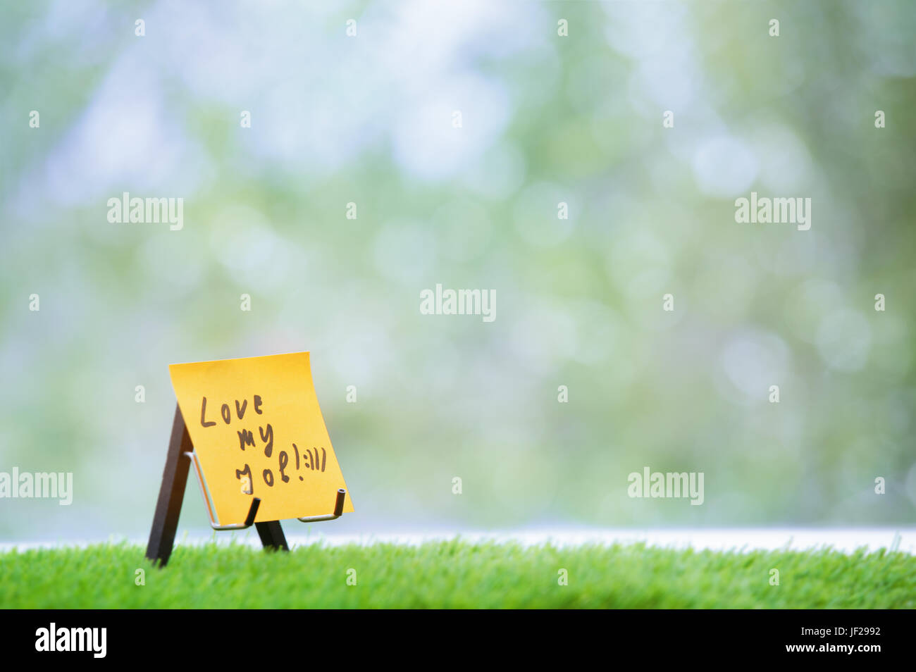 Adhesive note with Love my job text Stock Photo - Alamy