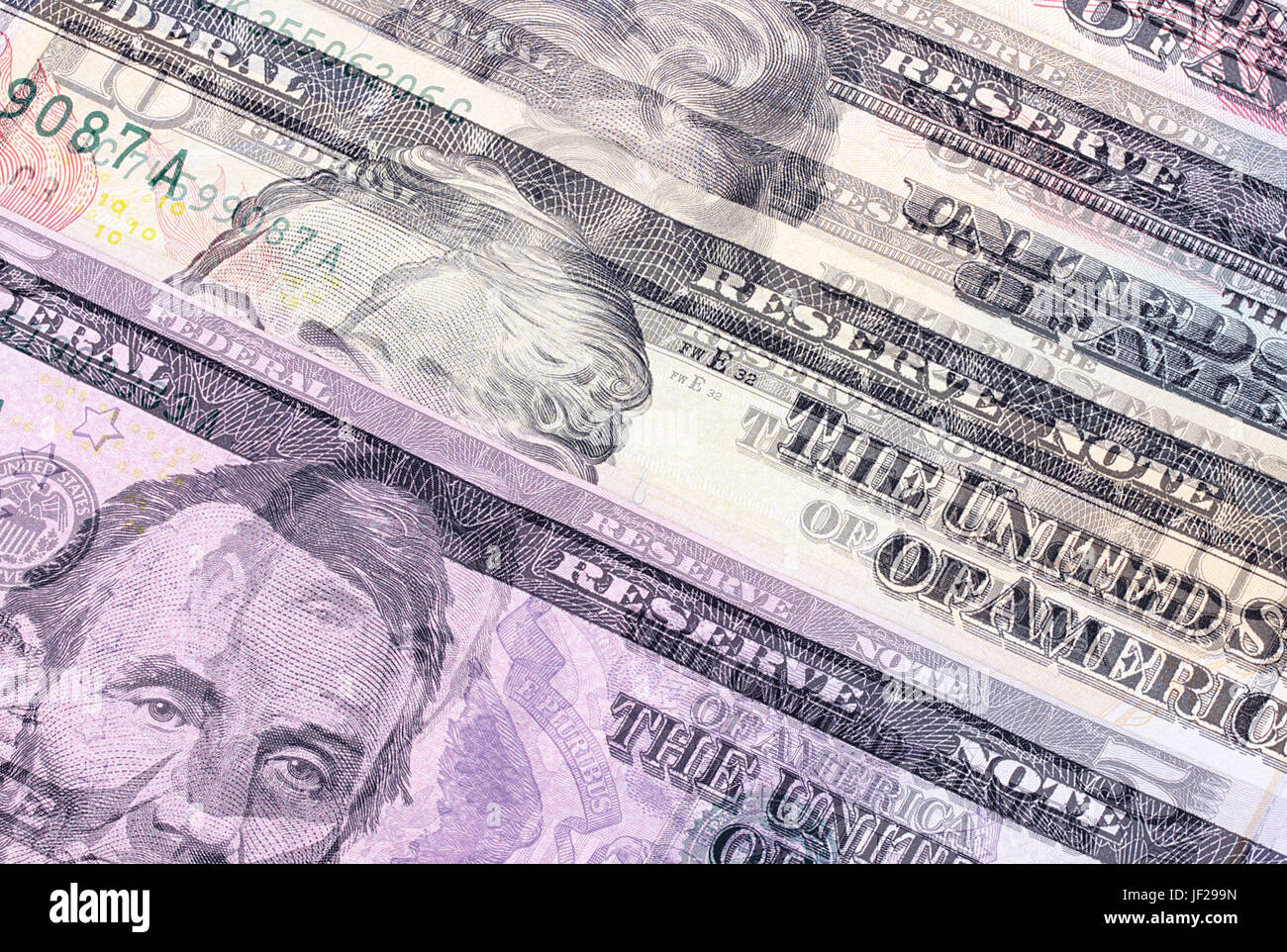 Abstract dollar bills of different denominations background Stock Photo ...