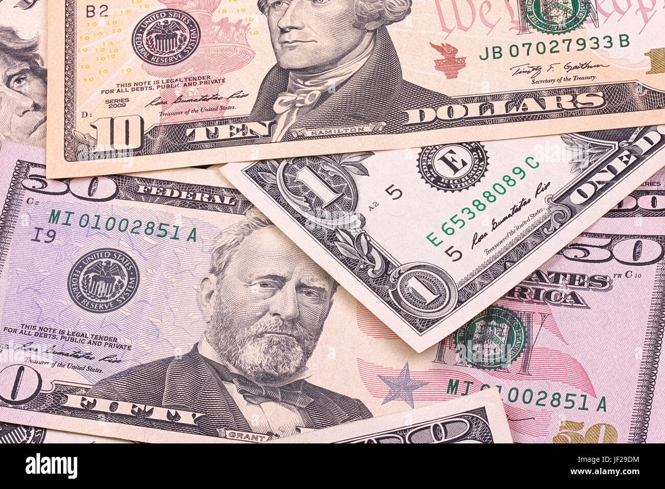 Abstract dollar bills of different denominations background Stock Photo ...