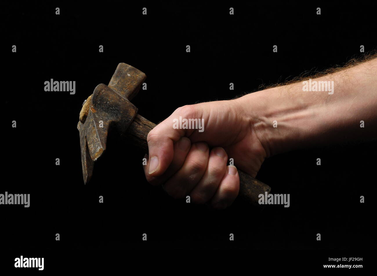 Hammer and a Hand Stock Photo - Alamy