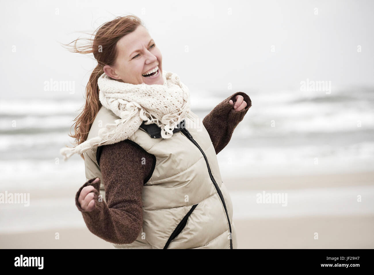 Happy woman on beach Stock Photo - Alamy