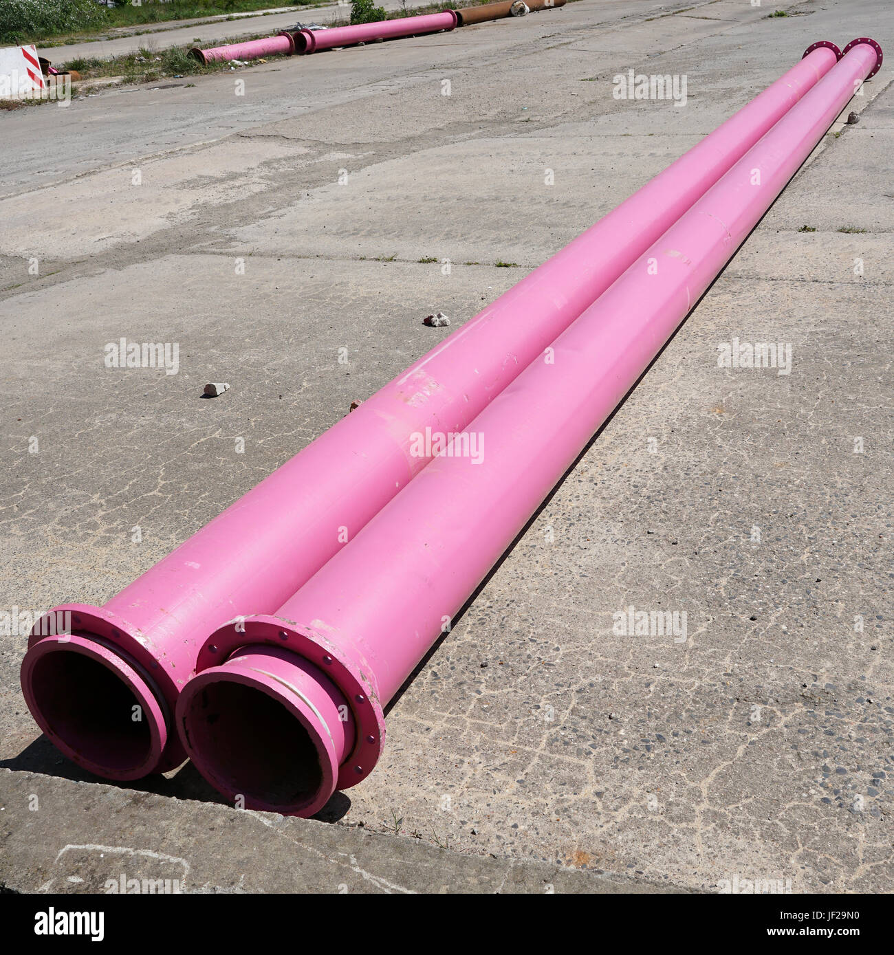 Pipes in a parking lot in Berlin Stock Photo - Alamy