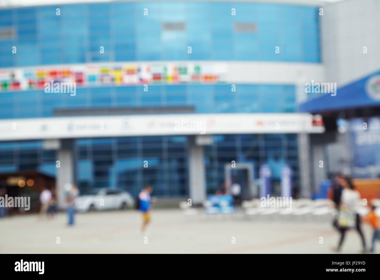blurred modern building in downtown. urban background with people on ...