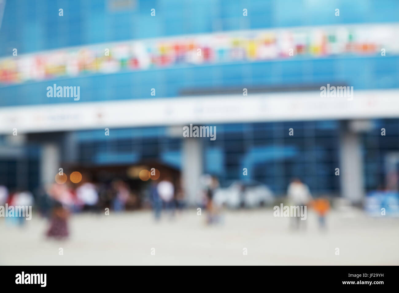 blurred modern building in downtown. urban background with people on ...