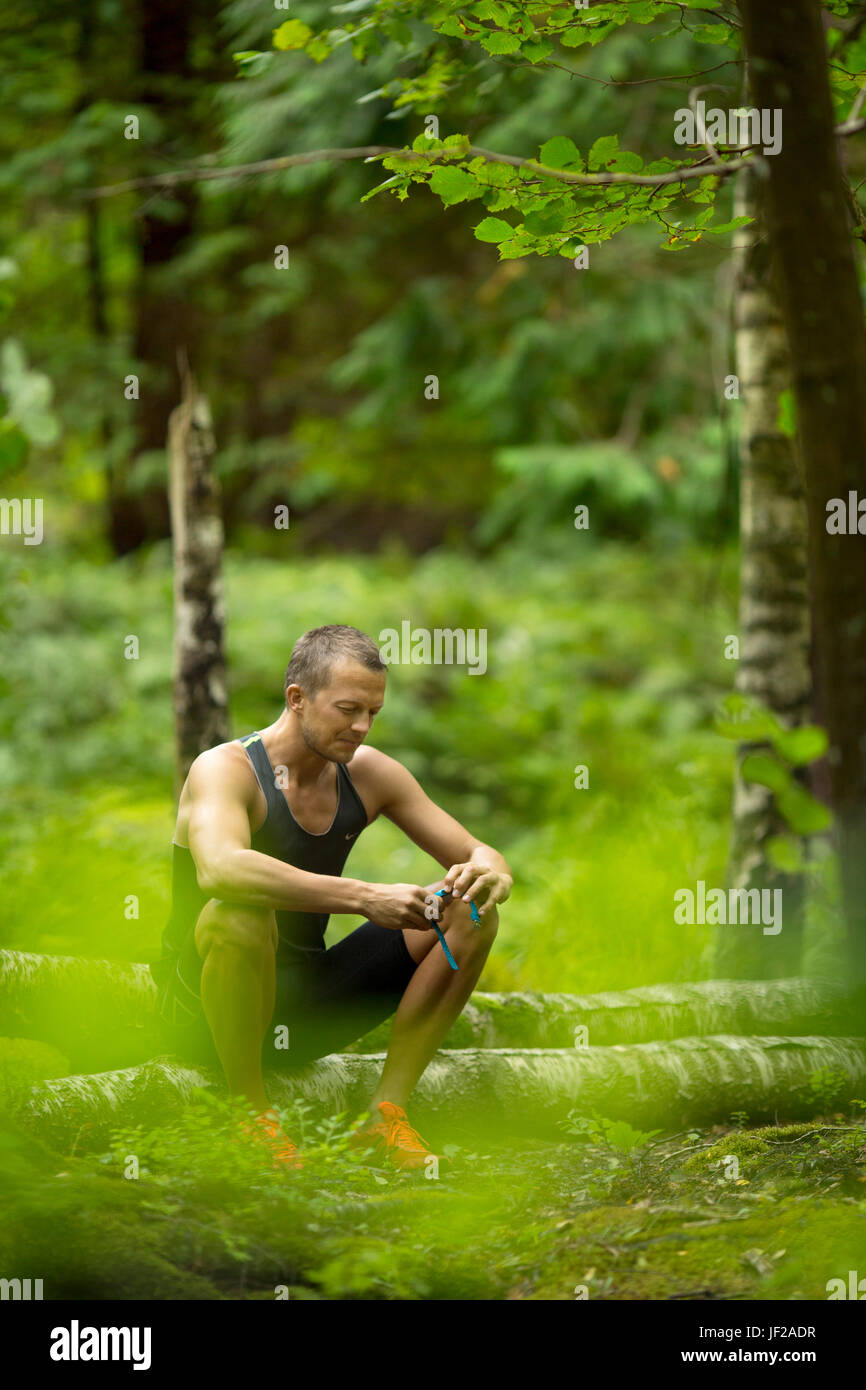 Mature grey haired man sitting hi-res stock photography and images - Alamy