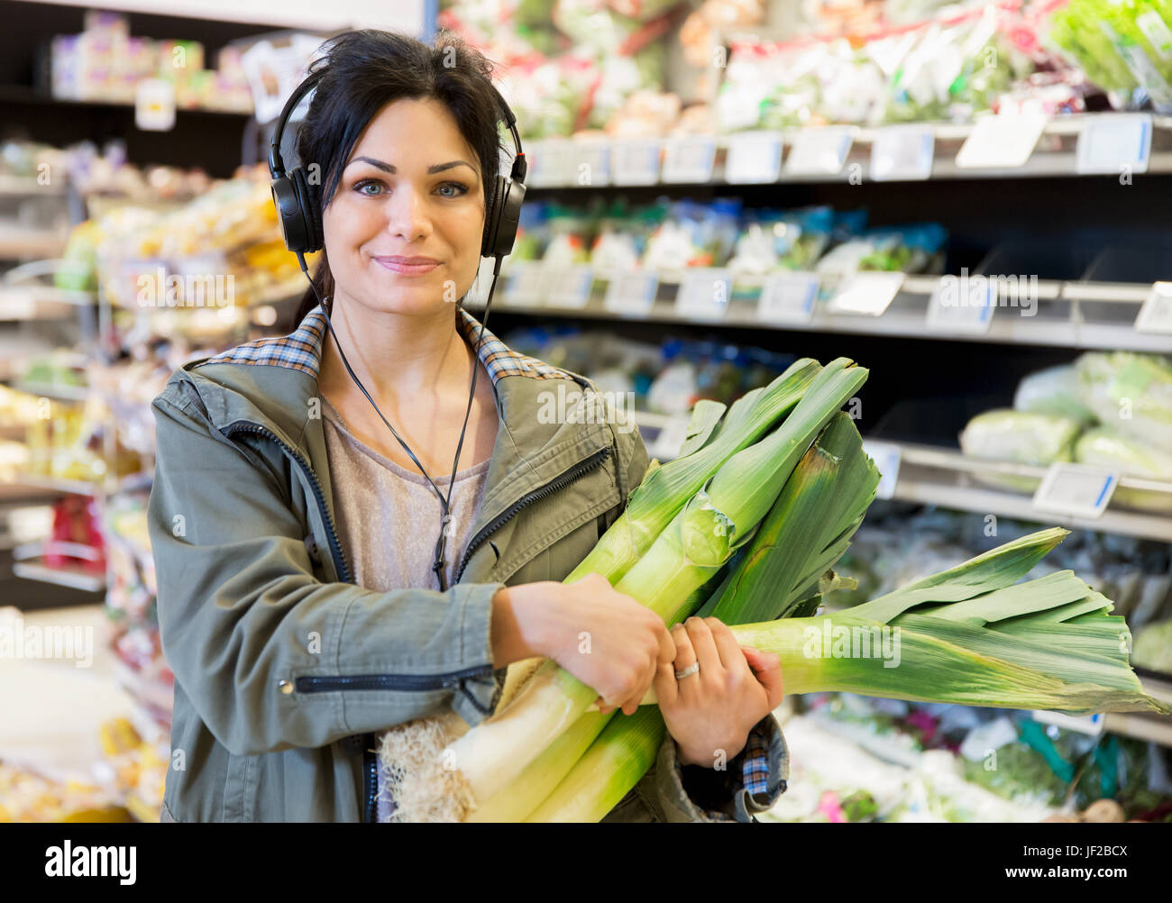 Smiling woman doing shopping Stock Photo - Alamy