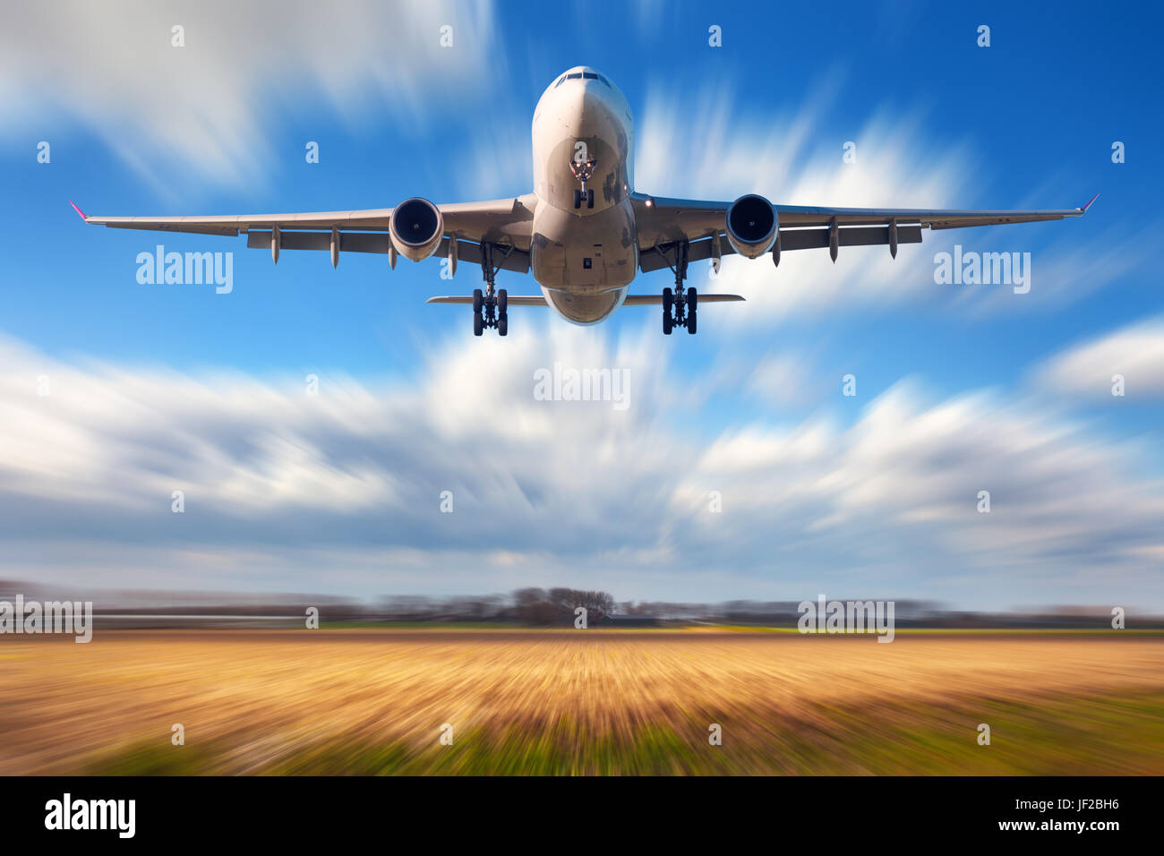 Airplane with motion blur effect. Landscape with passenger airplane is ...