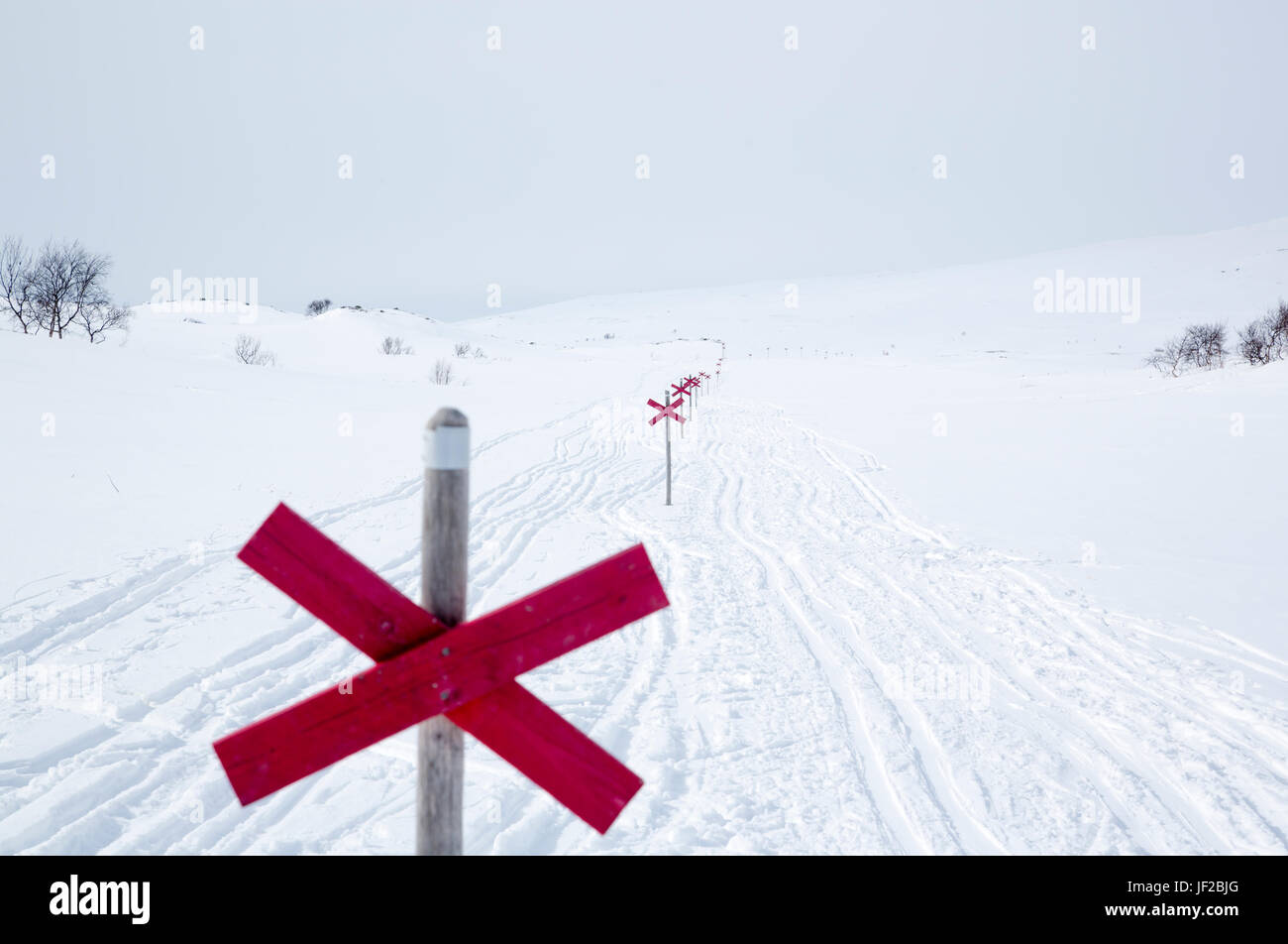 Winter landscape with trail markings Stock Photo - Alamy