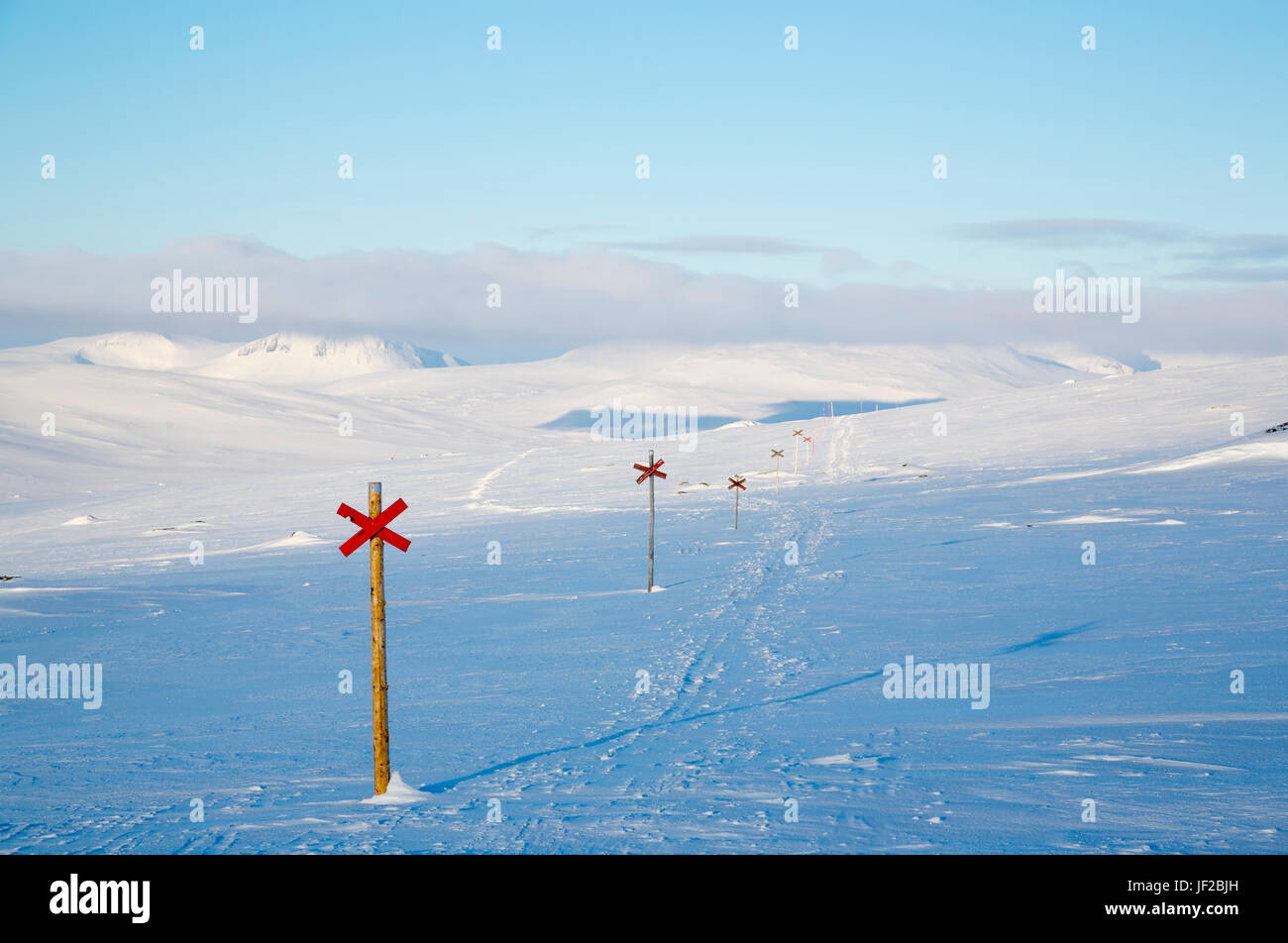 Winter landscape with trail markings Stock Photo - Alamy