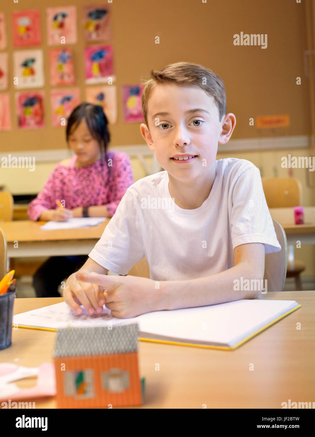 Boy in classroom Stock Photo - Alamy