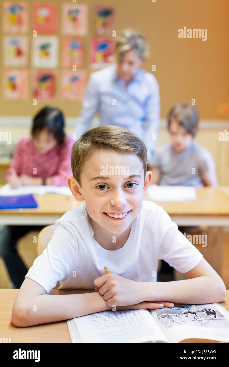 Boy in classroom Stock Photo - Alamy