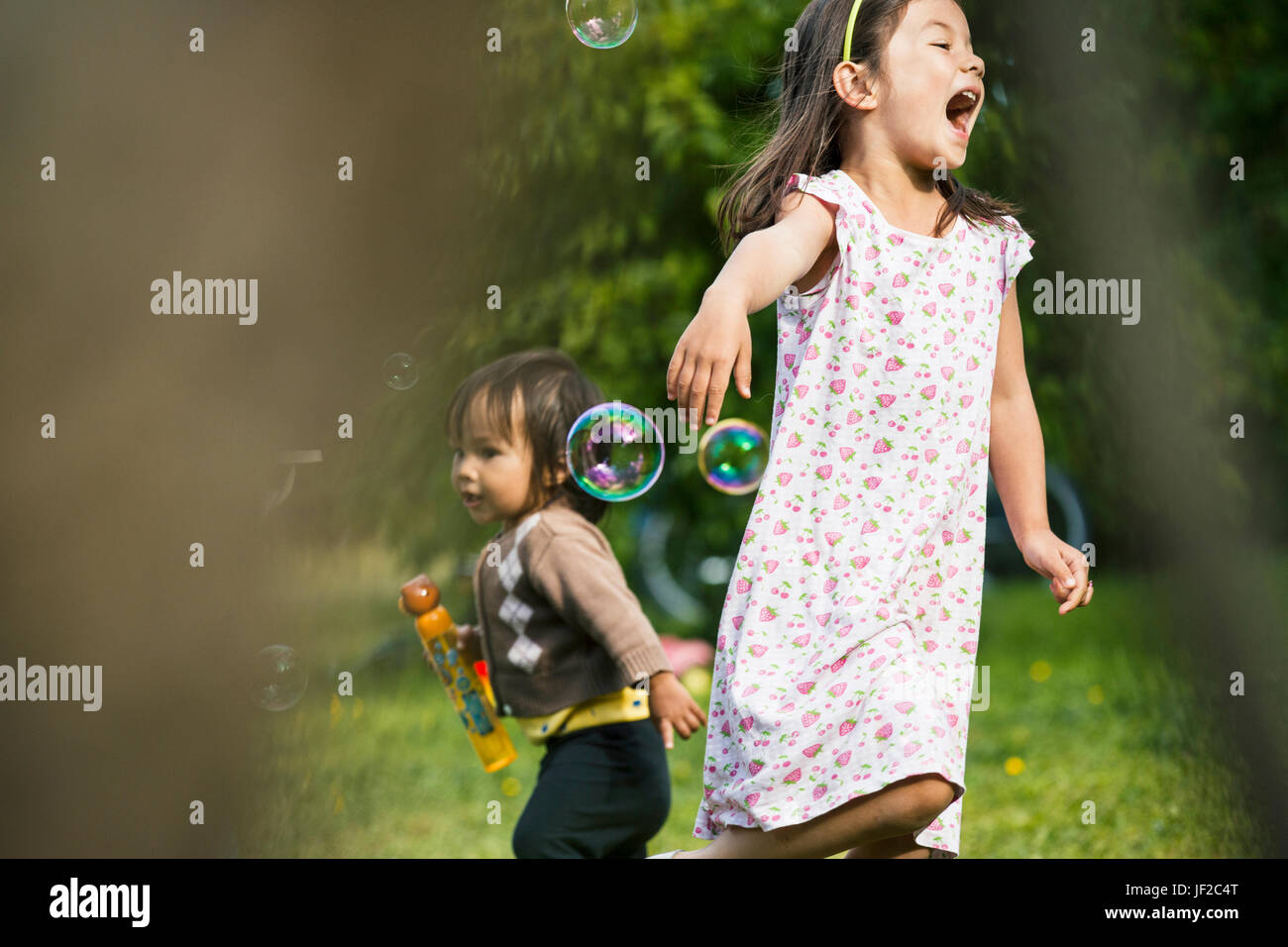 Two girls running away hi-res stock photography and images - Alamy