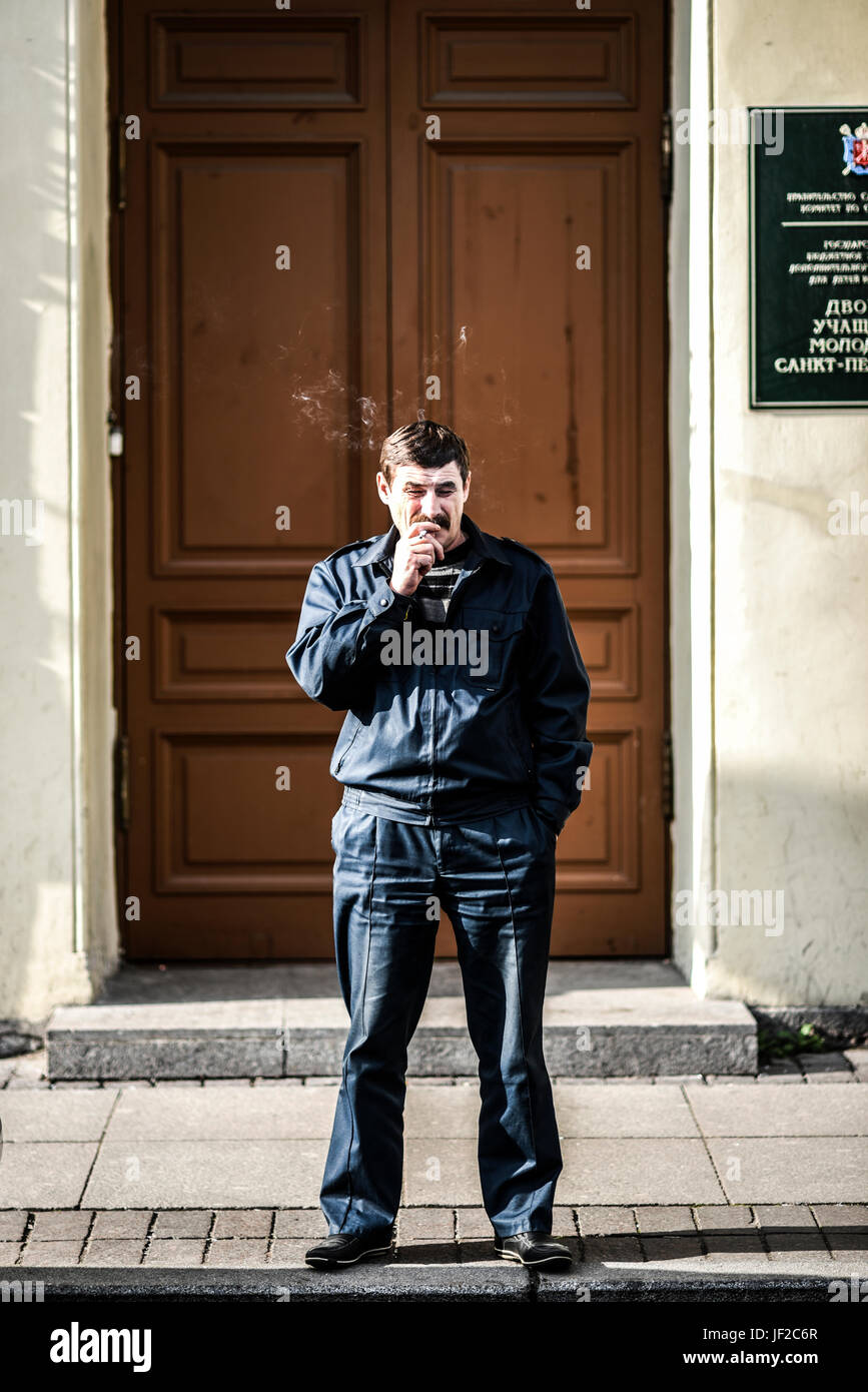 Petersburg, Russia, October 1, 2016: Man smoking cigarette in front of ...