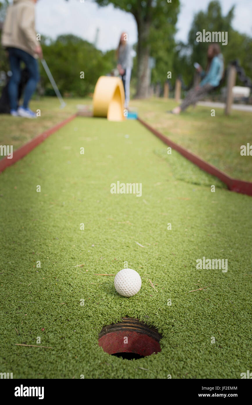Hole on mini golf course Stock Photo - Alamy