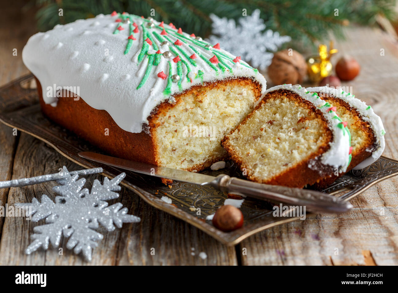 Piece of almond cake with Christmas decorations Stock Photo - Alamy