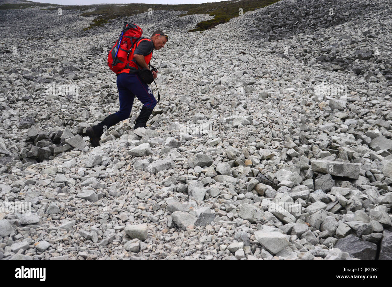 Man climbing up hill hi-res stock photography and images - Alamy