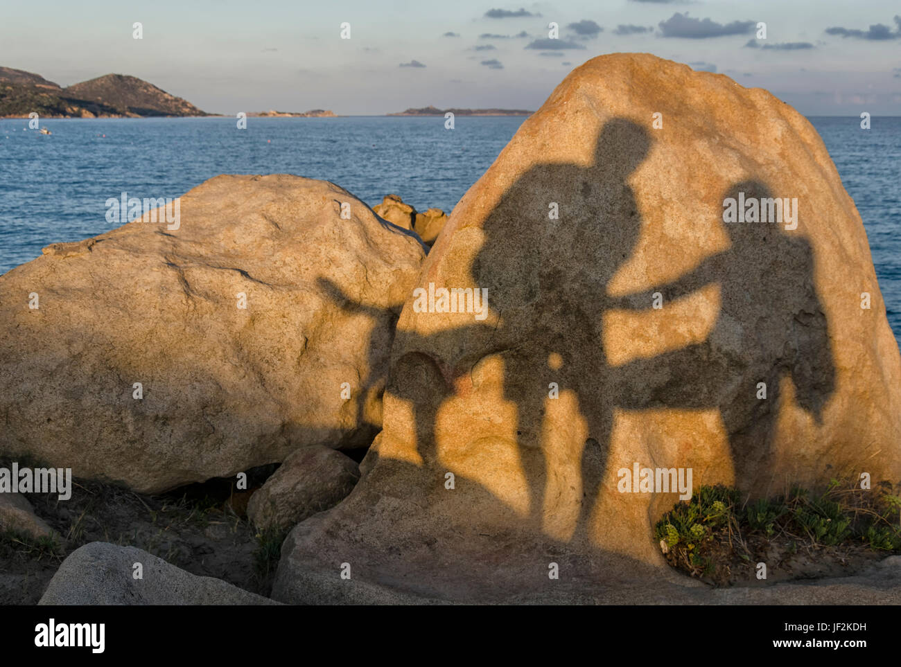 Fun with the shadows on the beach Stock Photo - Alamy