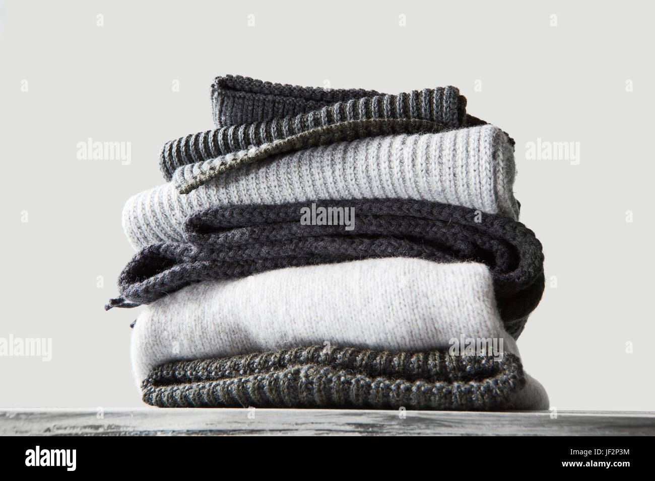 Stack colorful folded sweaters hi-res stock photography and images - Alamy